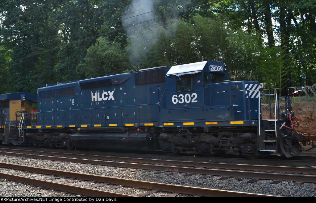 HLCX SD40-2 6302 works hard trailing 5214 on Q300-26